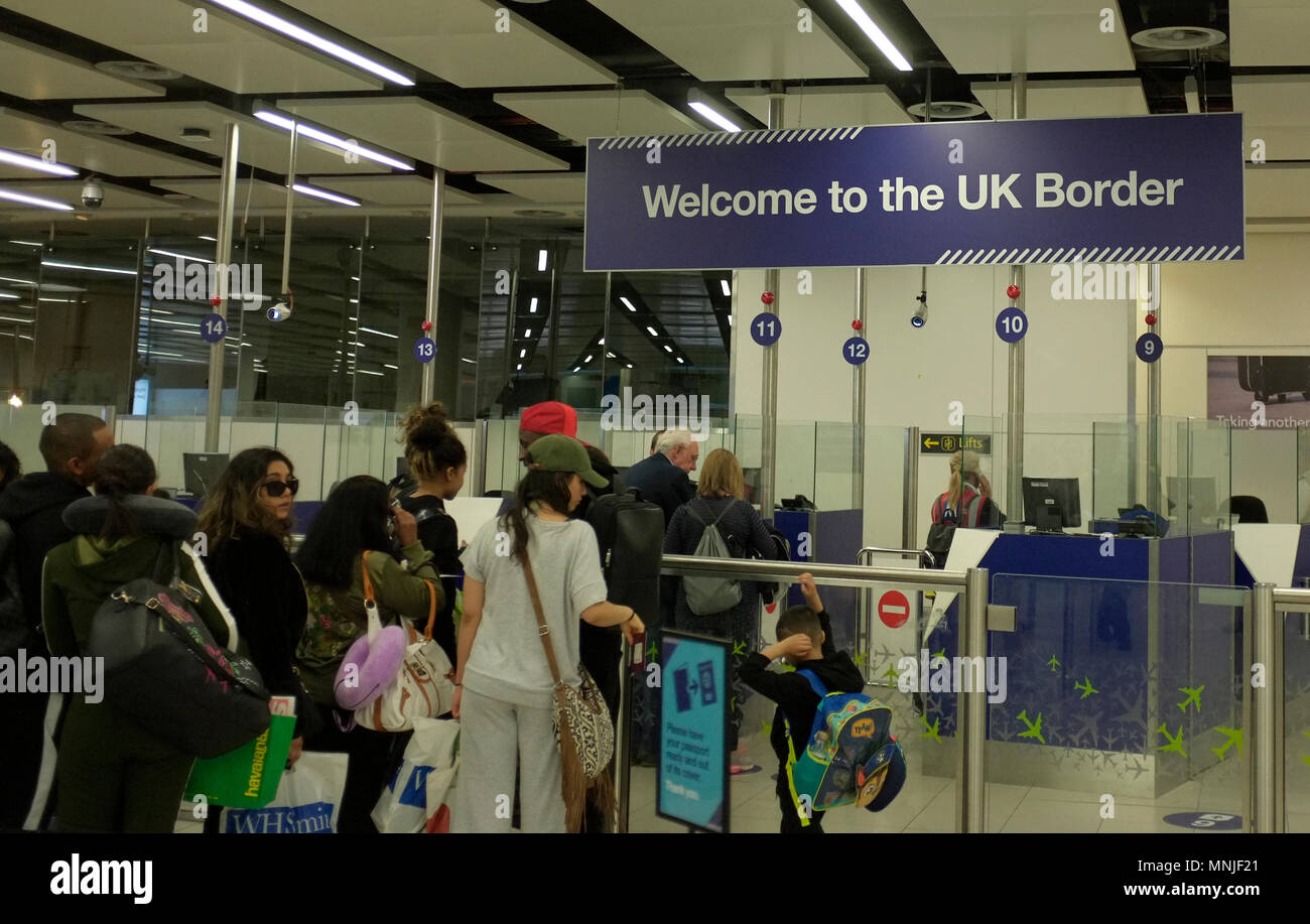 people arriving and entering UK through the border UK passport control ...
