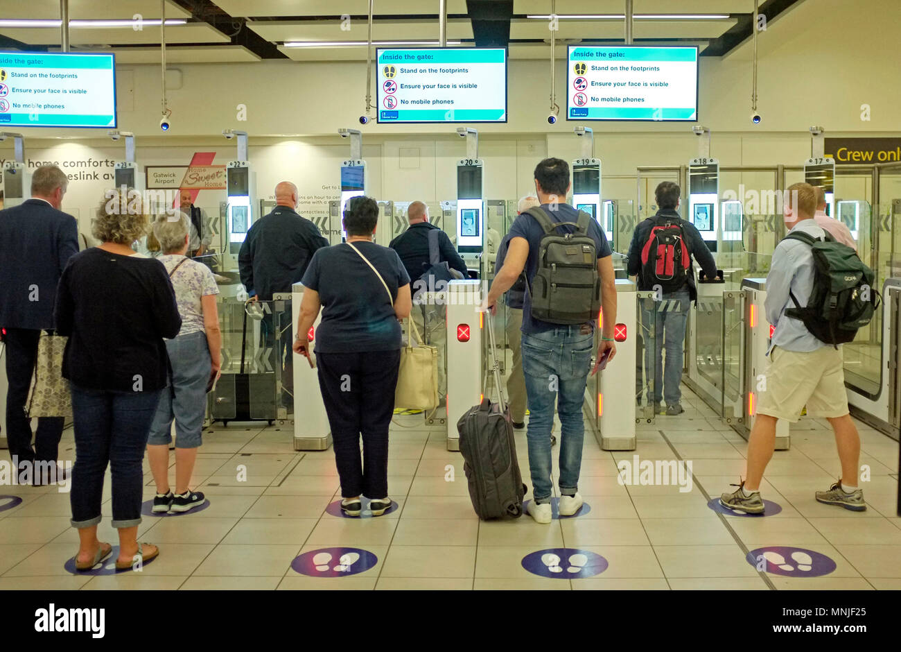 People Arriving And Entering Uk Through The E Passport Border Passport Control Gates At Gatwick