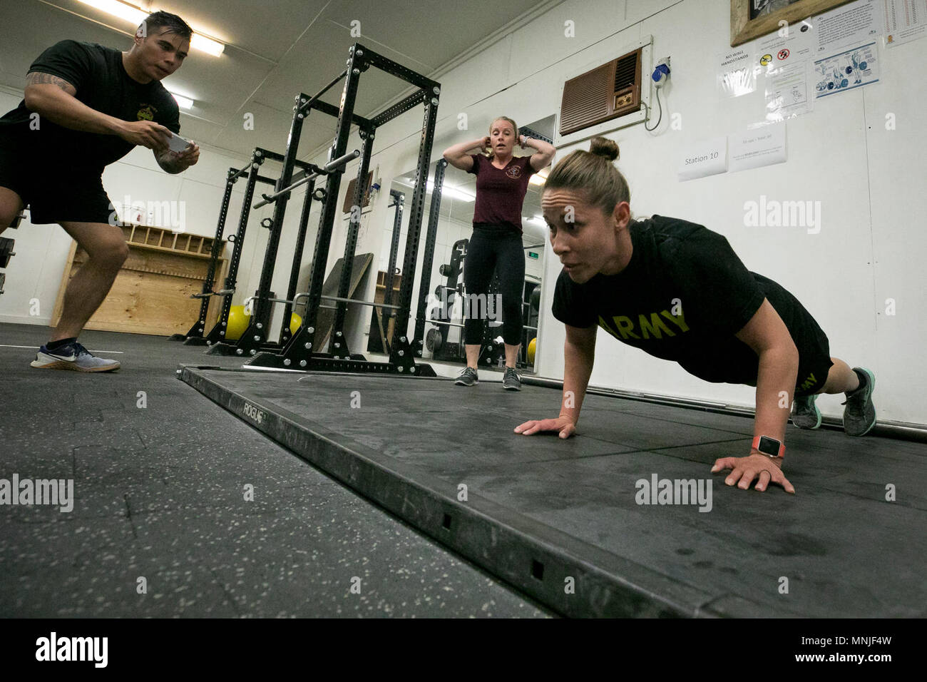 U.S. Army Spc. Cindy Veza, 82nd Sustainment Brigade, does push-ups ...