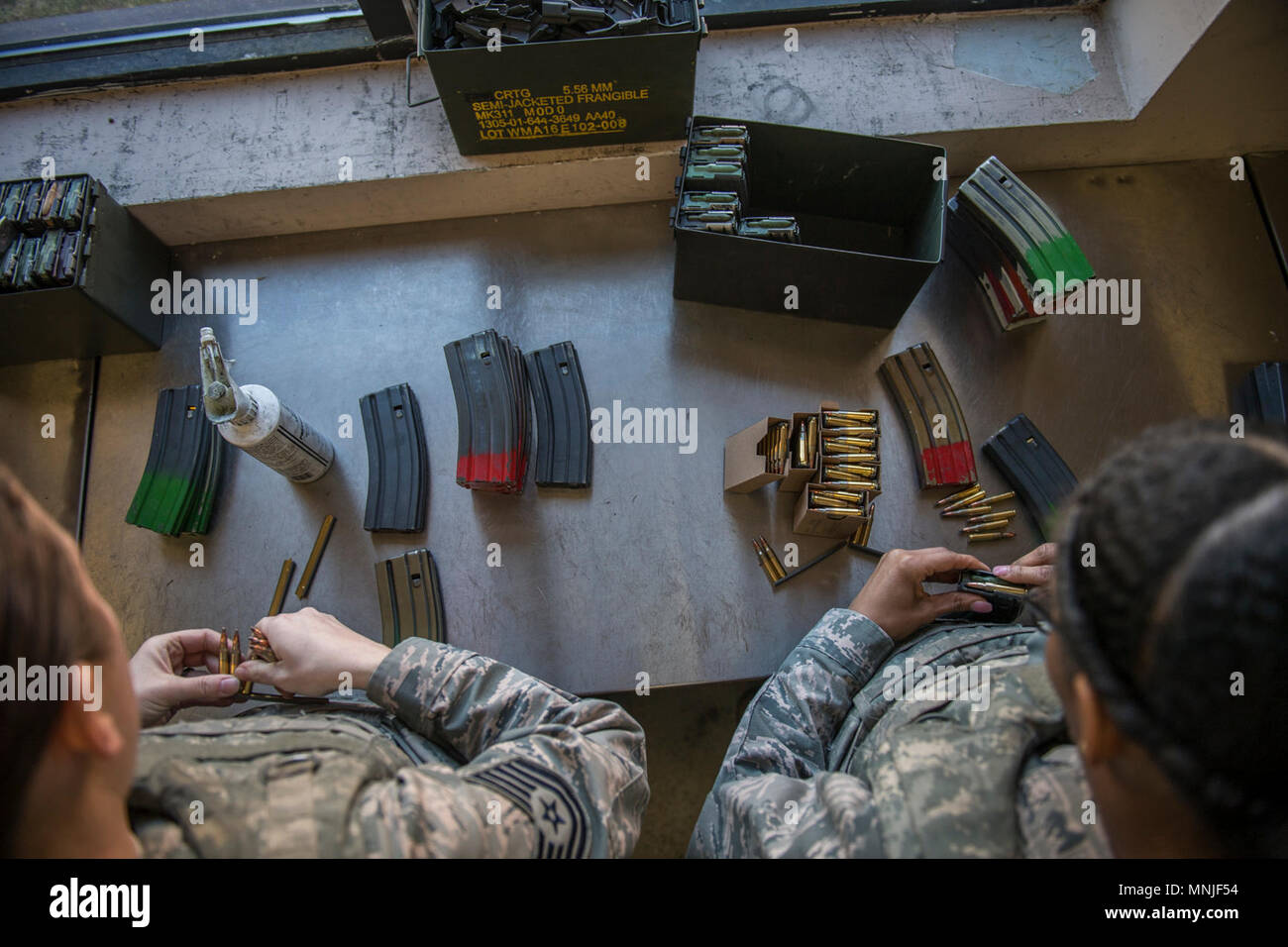 Citizen Airmen with the 932nd Airlift Wing, load magazines in ...