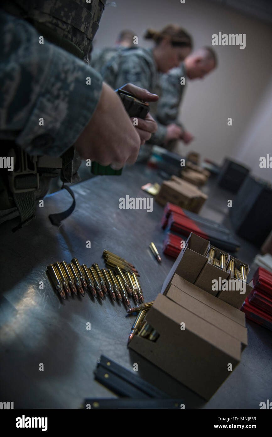 Citizen Airmen with the 932nd Airlift Wing, load magazines in ...
