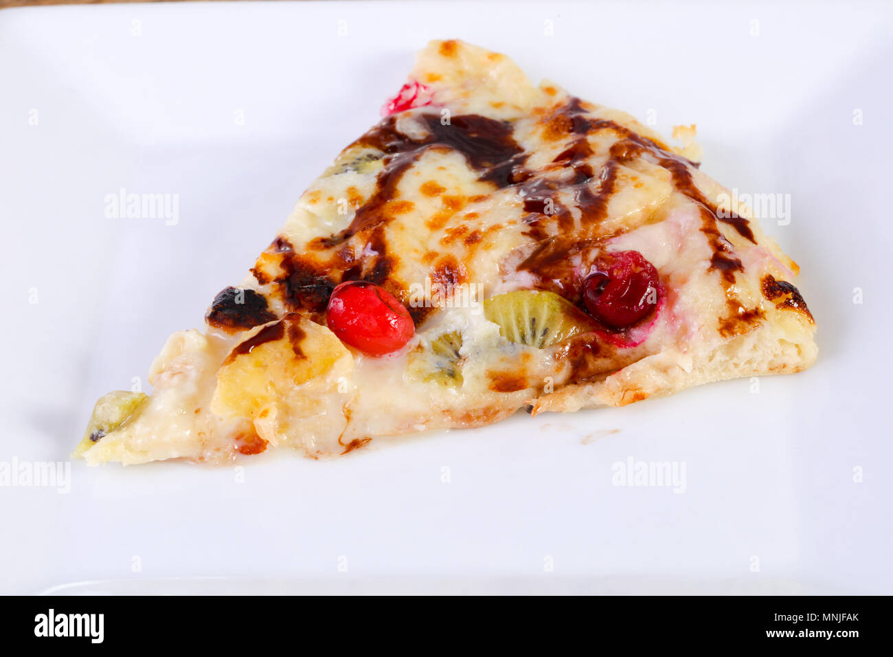 Sweet pizza with fruits and cheese Stock Photo - Alamy