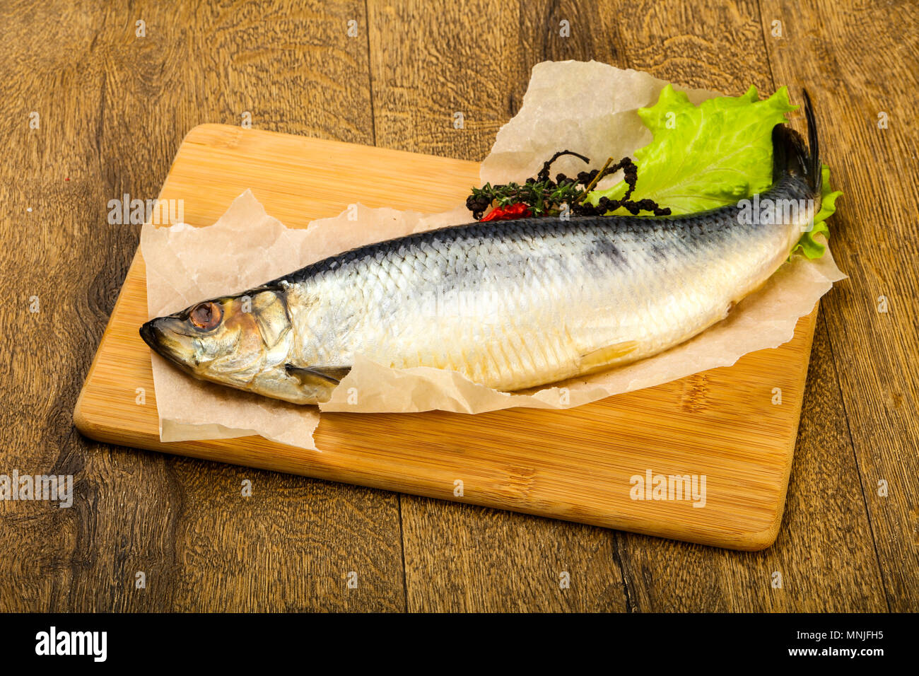 Salted Herring fish with pepper and spices Stock Photo - Alamy