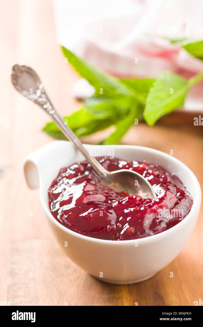 Raspberry jam jelly in bowl Stock Photo - Alamy