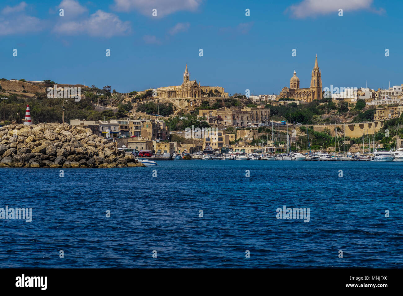 Gozo Island, Malta port landscape. Moored boats at port with background ...