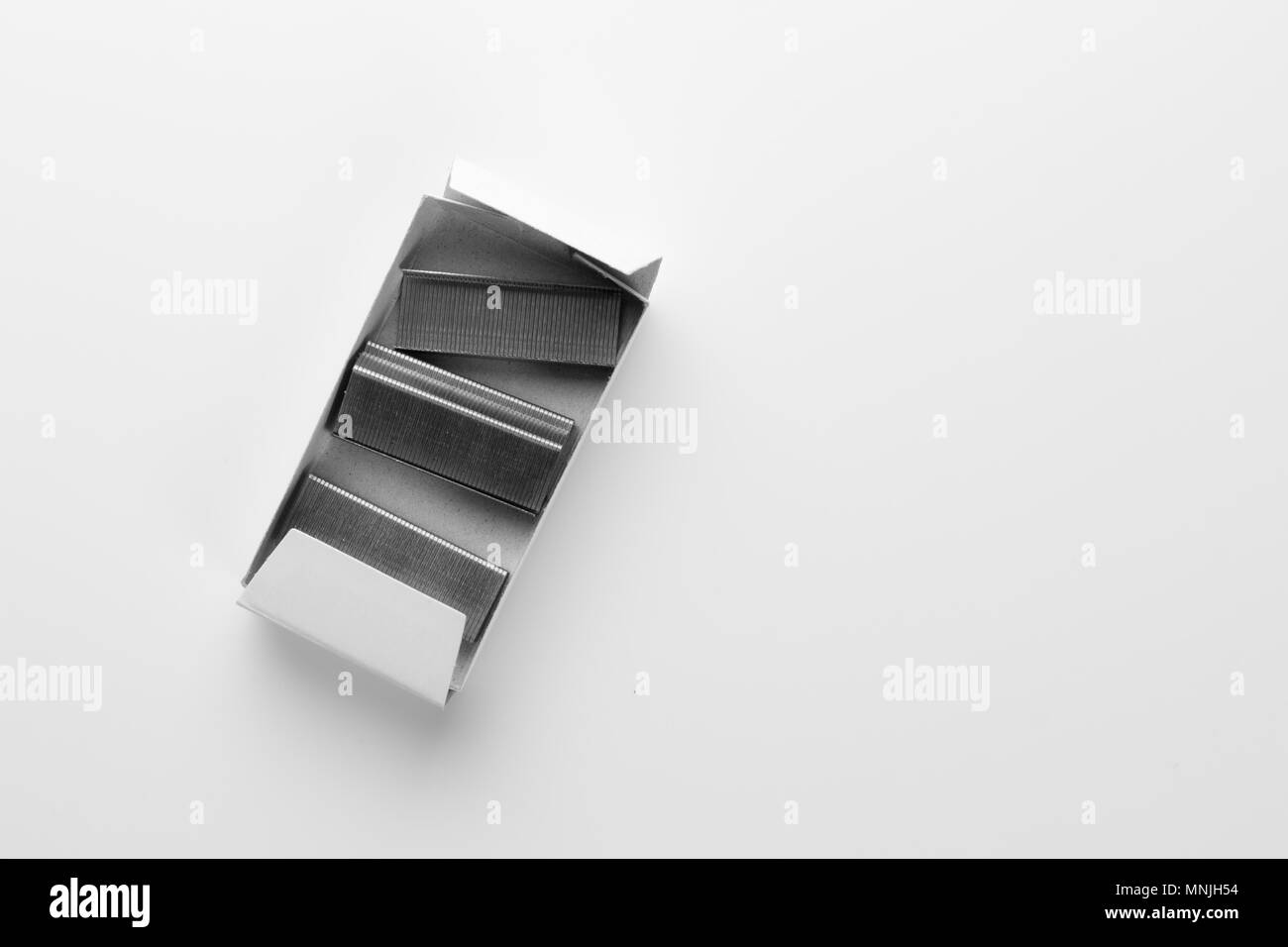 Metal staples in a cardboard box, top view Stock Photo - Alamy