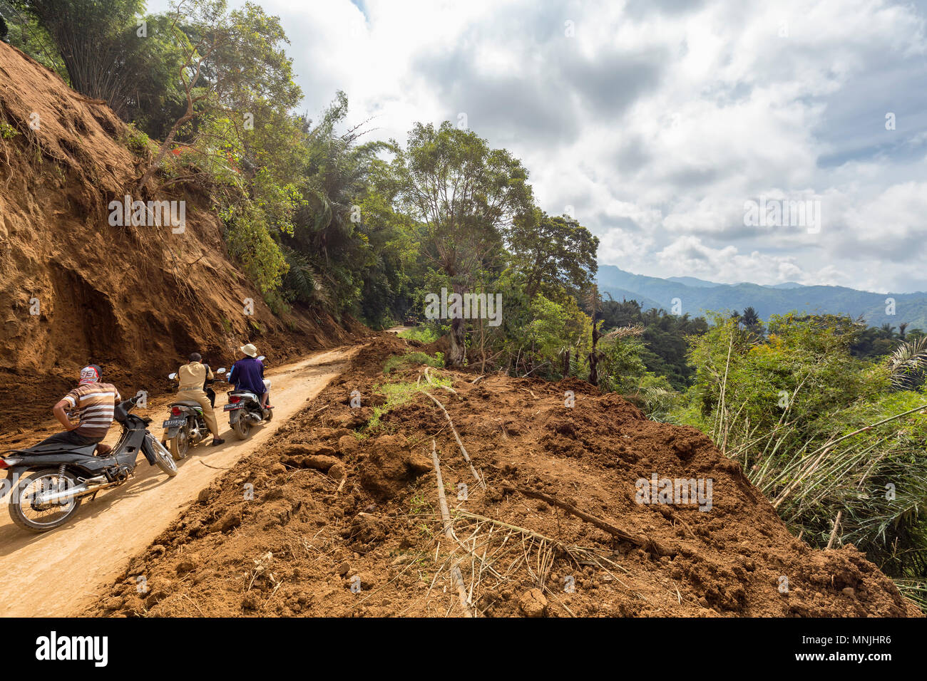 MONI, INDONESIA - MAY 16: Unidentified people wait for construction at ...