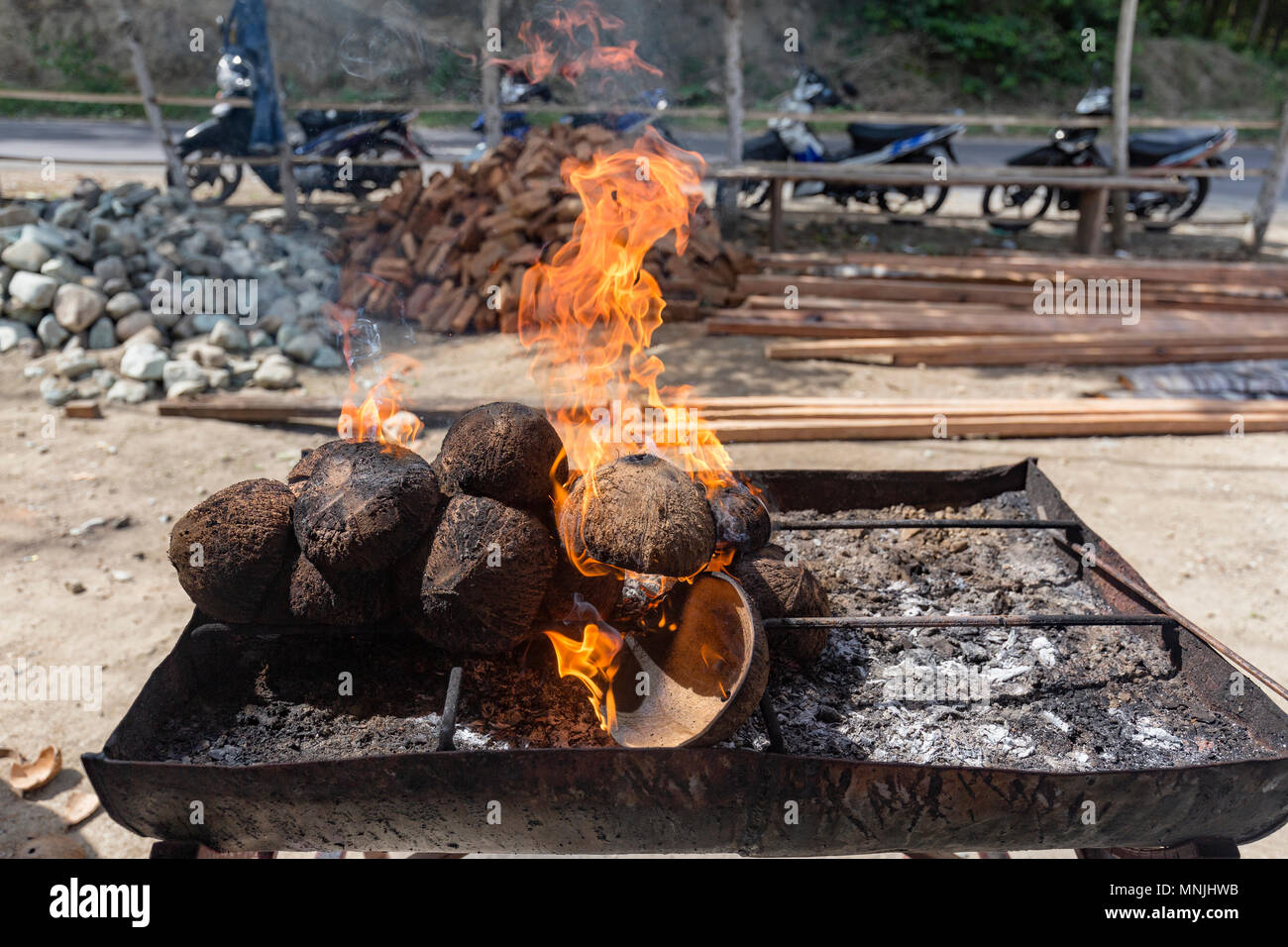Burning coconut shells hi-res stock photography and images - Alamy