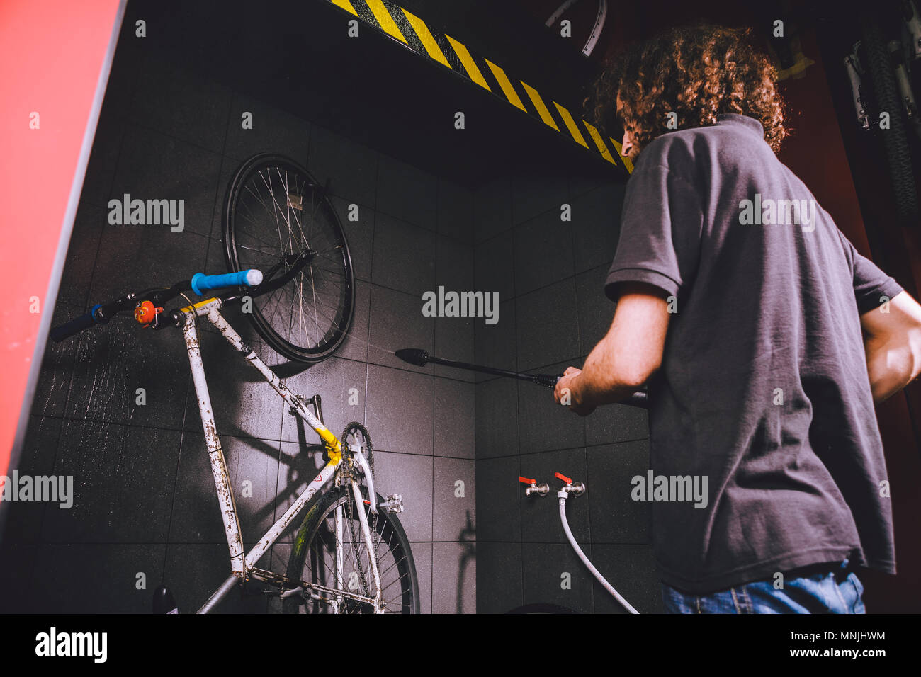 Services professional washing of a bicycle in the workshop. Close-up of ...