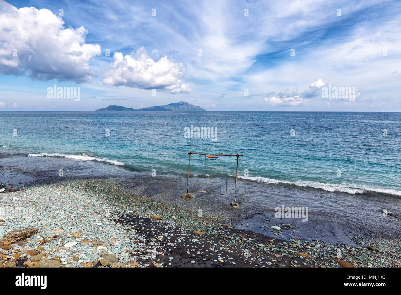 Blue stone beach in Flores, Indonesia Stock Photo - Alamy