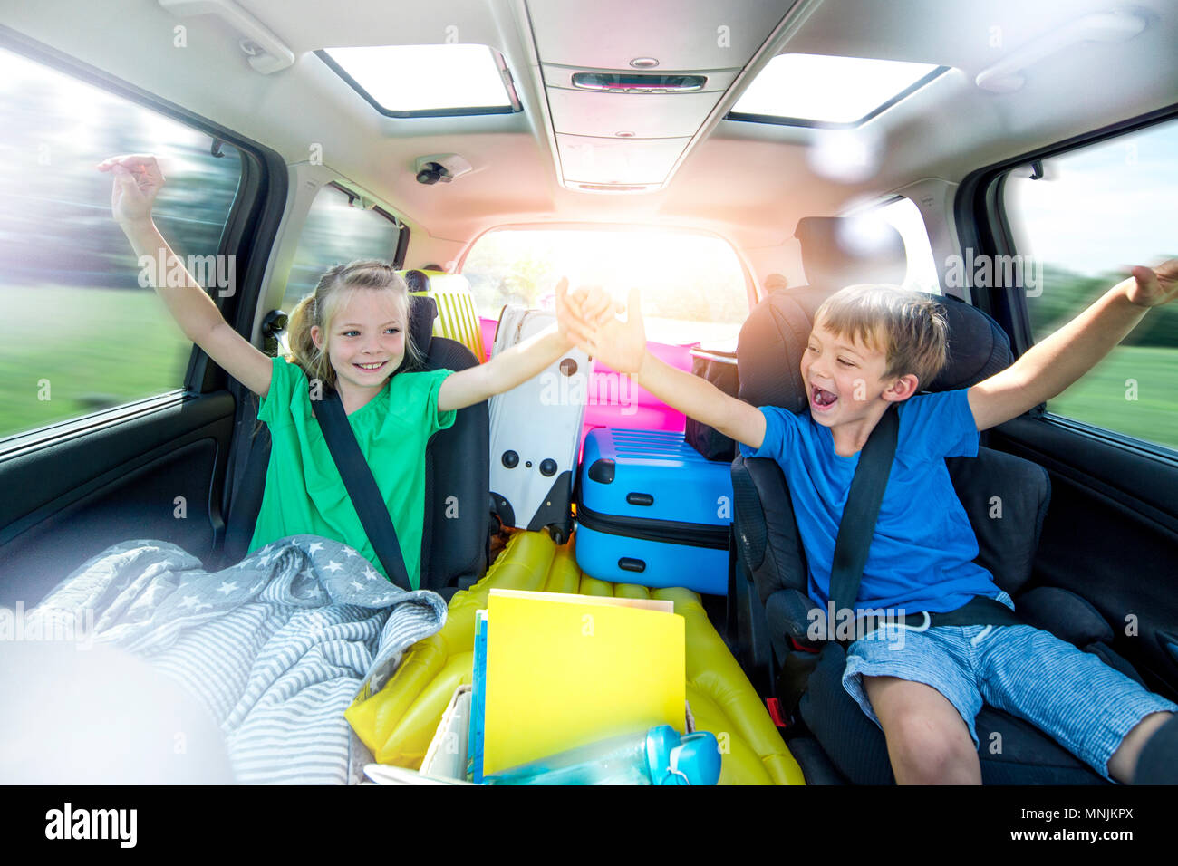 Holidays - Children relax in the car during a long car journey Stock ...
