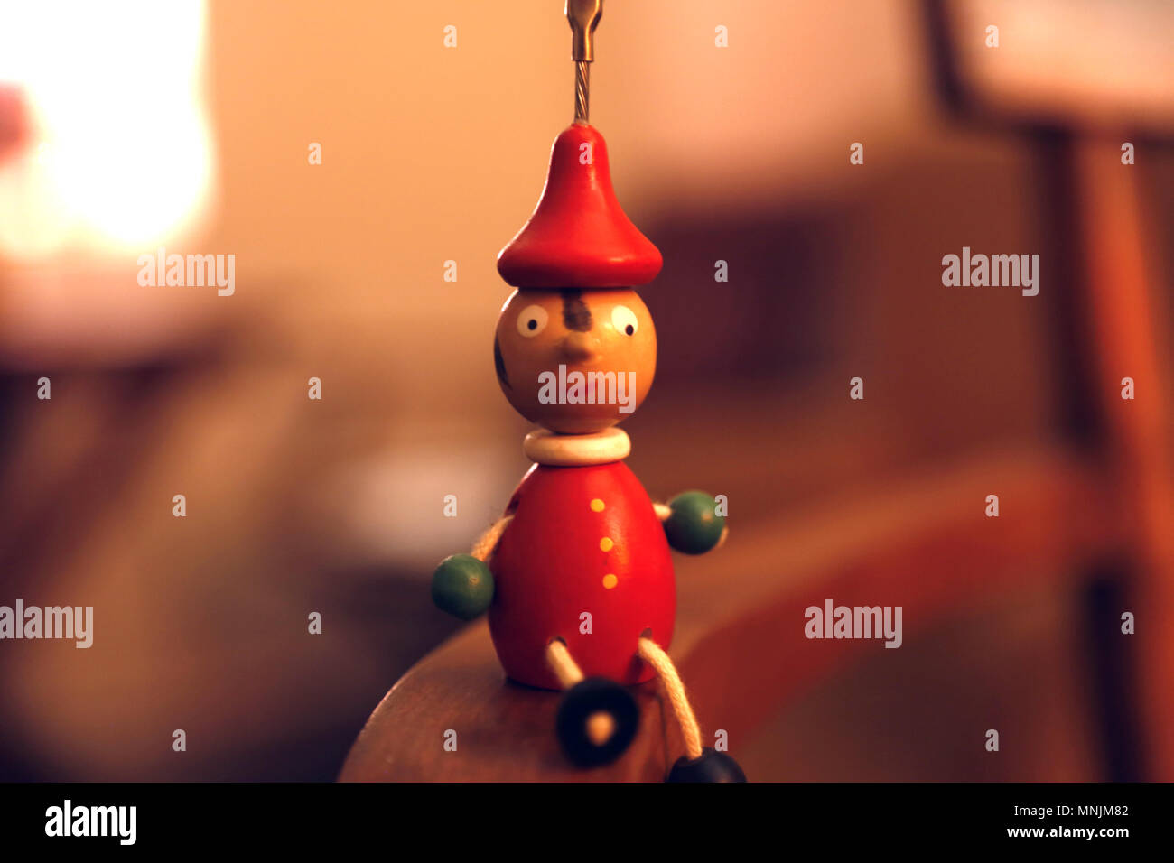 Pinocchio seating on the office chair Stock Photo - Alamy