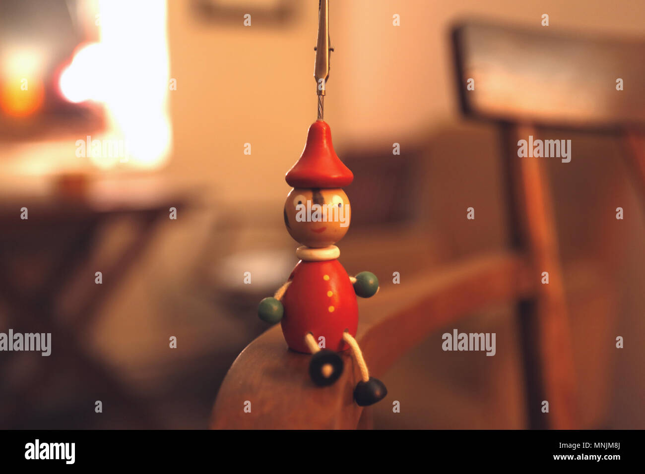 Pinocchio seating on the office chair Stock Photo - Alamy