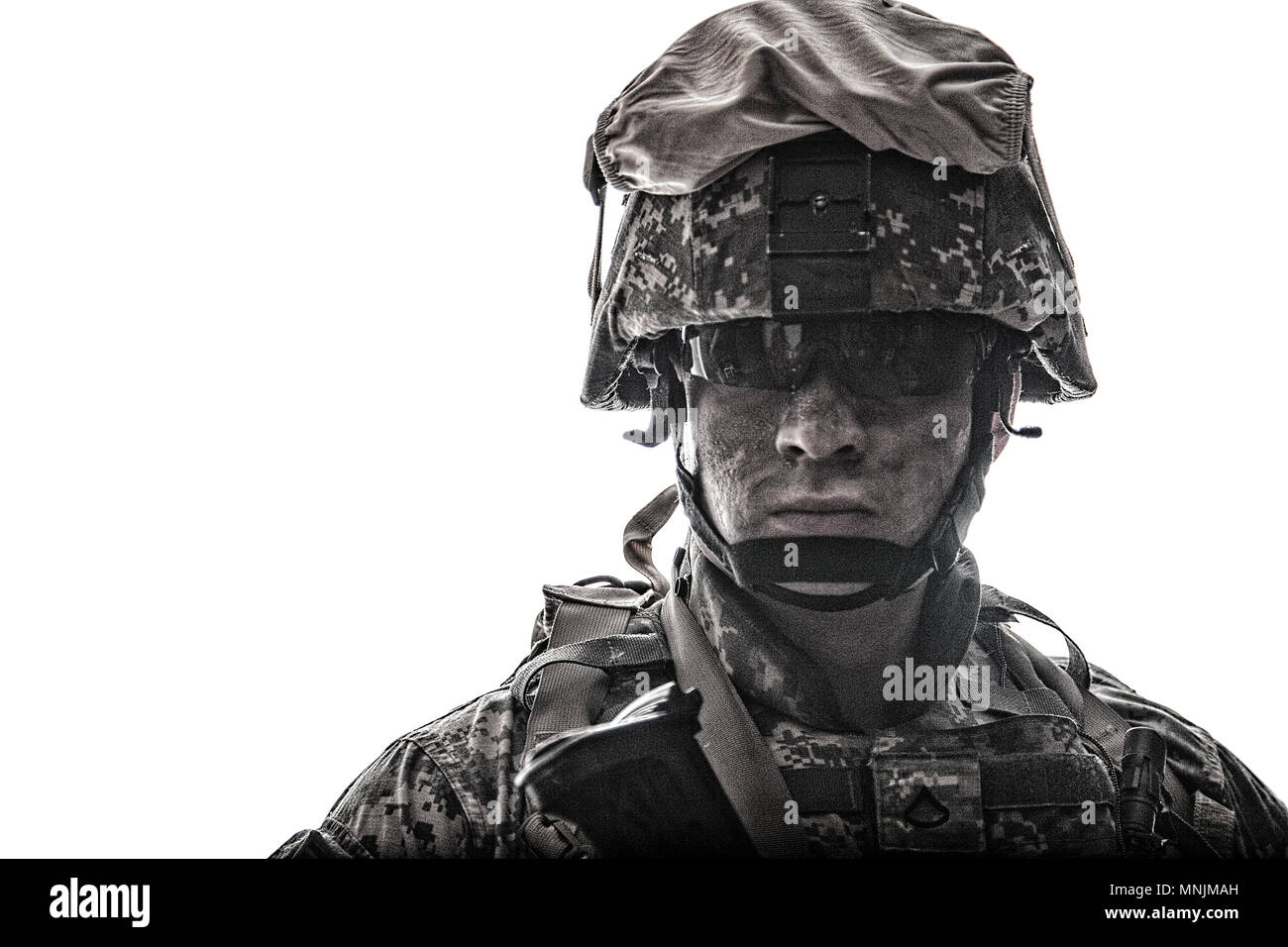 Equipped army soldier with dirty face studio shot Stock Photo - Alamy