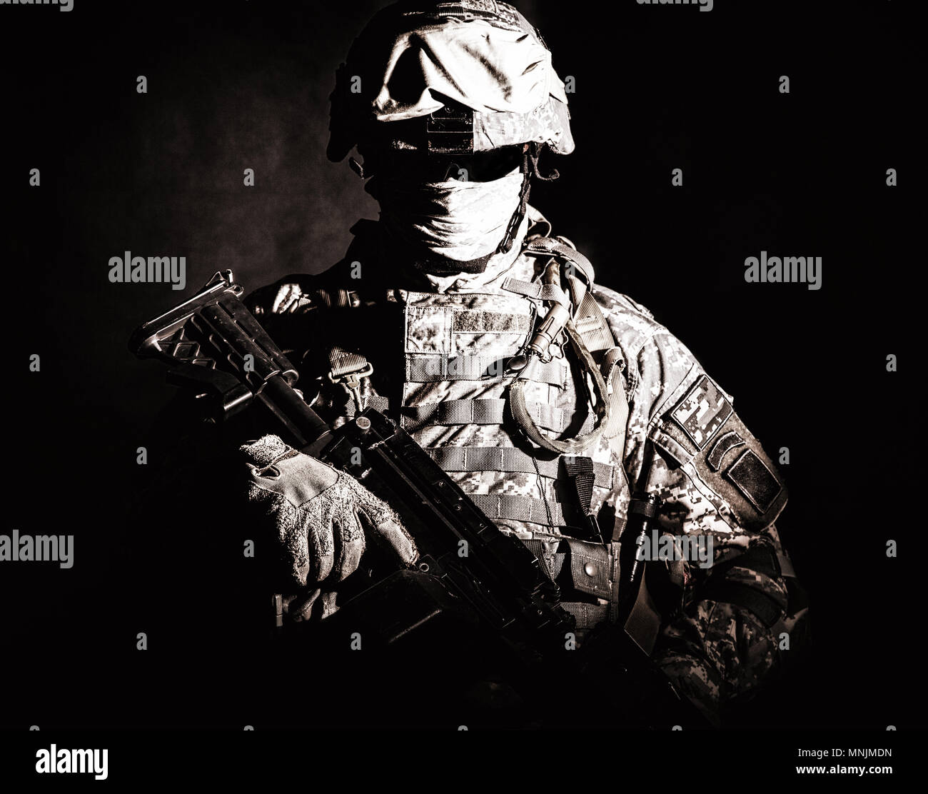 US marine infantry with hidden face holding rifle Stock Photo - Alamy