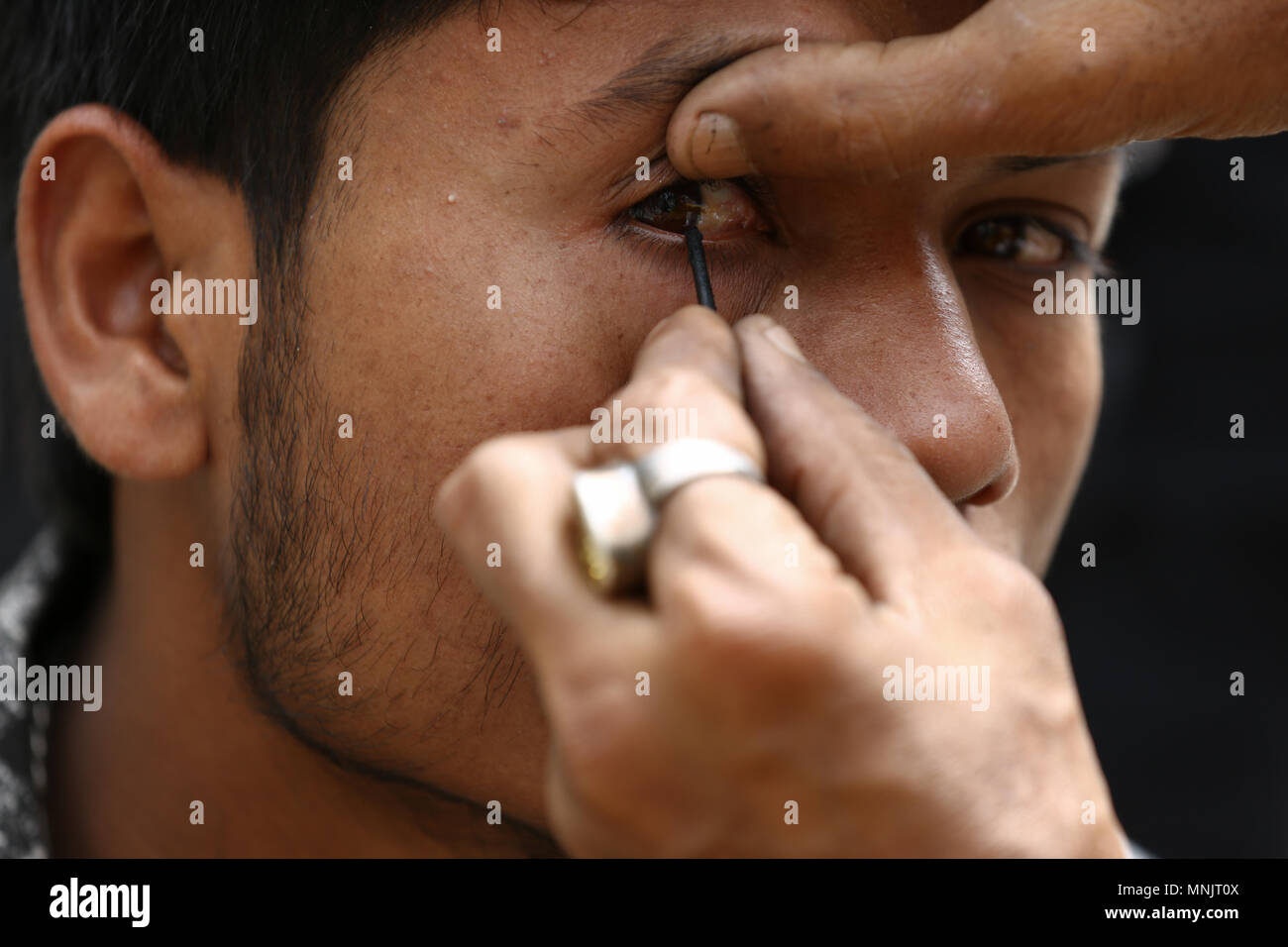 Nepal. 18th May, 2018. A nepalese muslim boy gets kohl applied to his ...