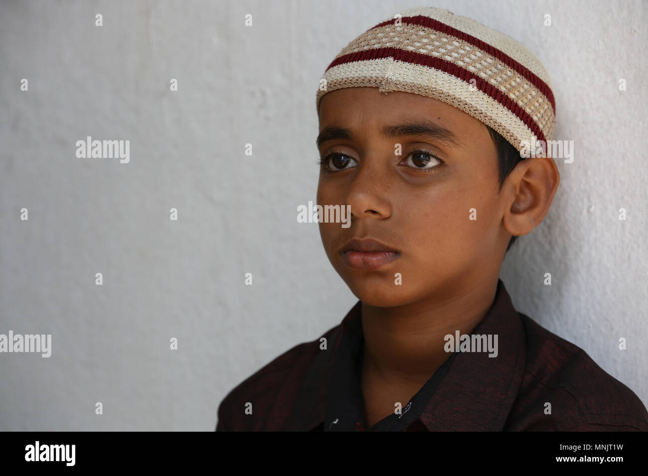 Nepal. 18th May, 2018. A nepalese muslim boy arrives to offer friday ...