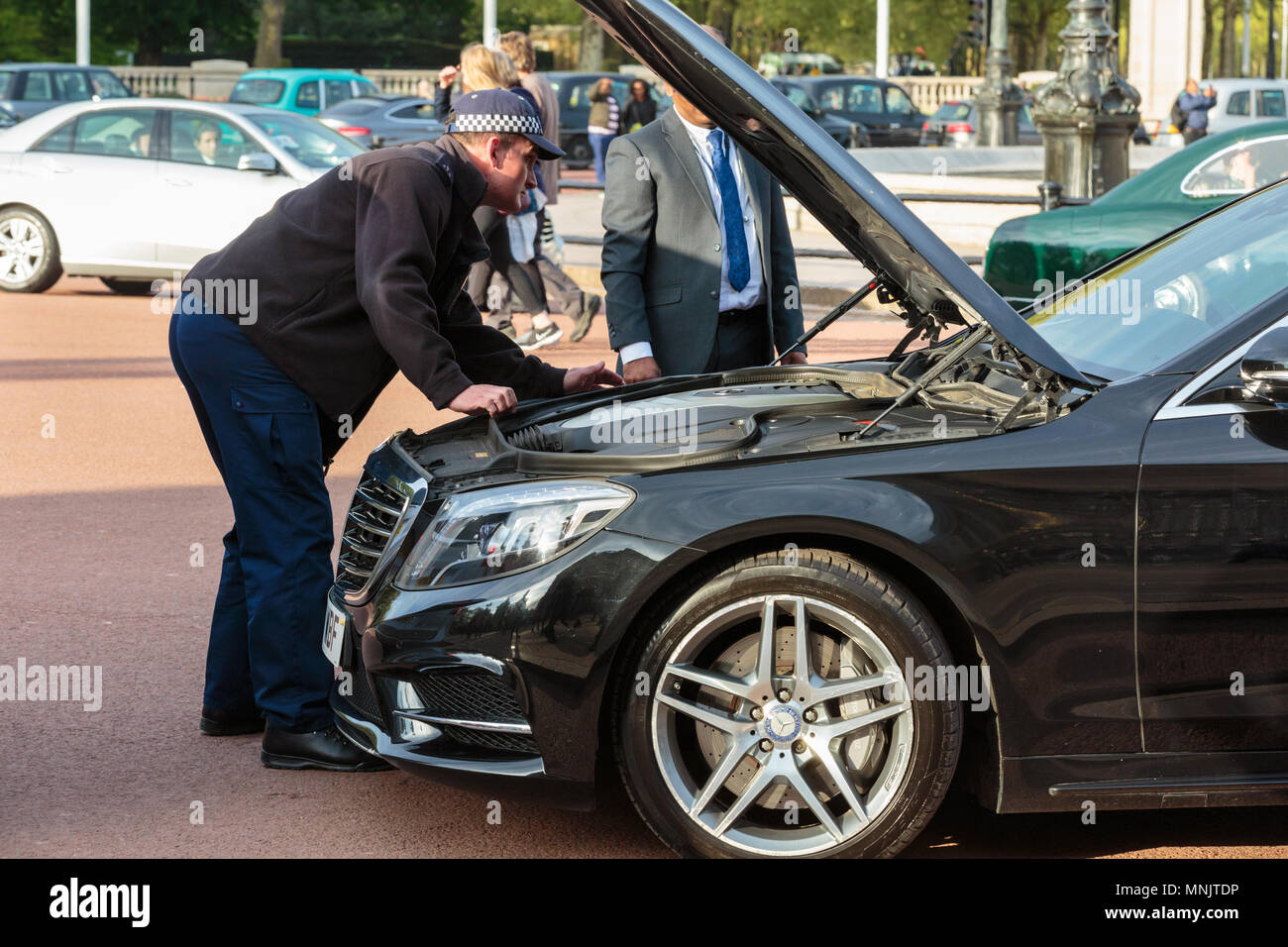 A car is searched and undergoes security checks by police with the ...