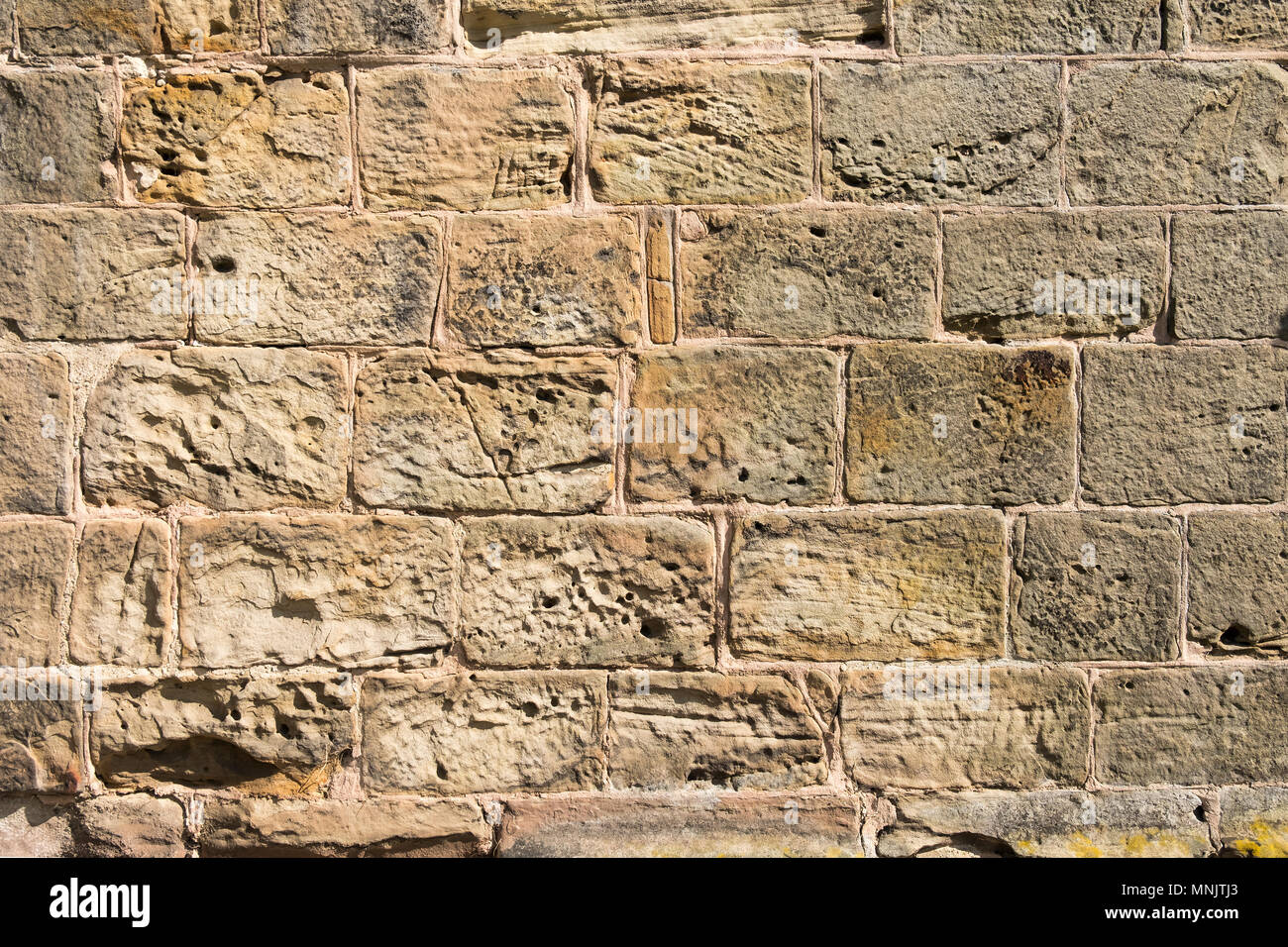 Eroded limestone church wall Stock Photo - Alamy