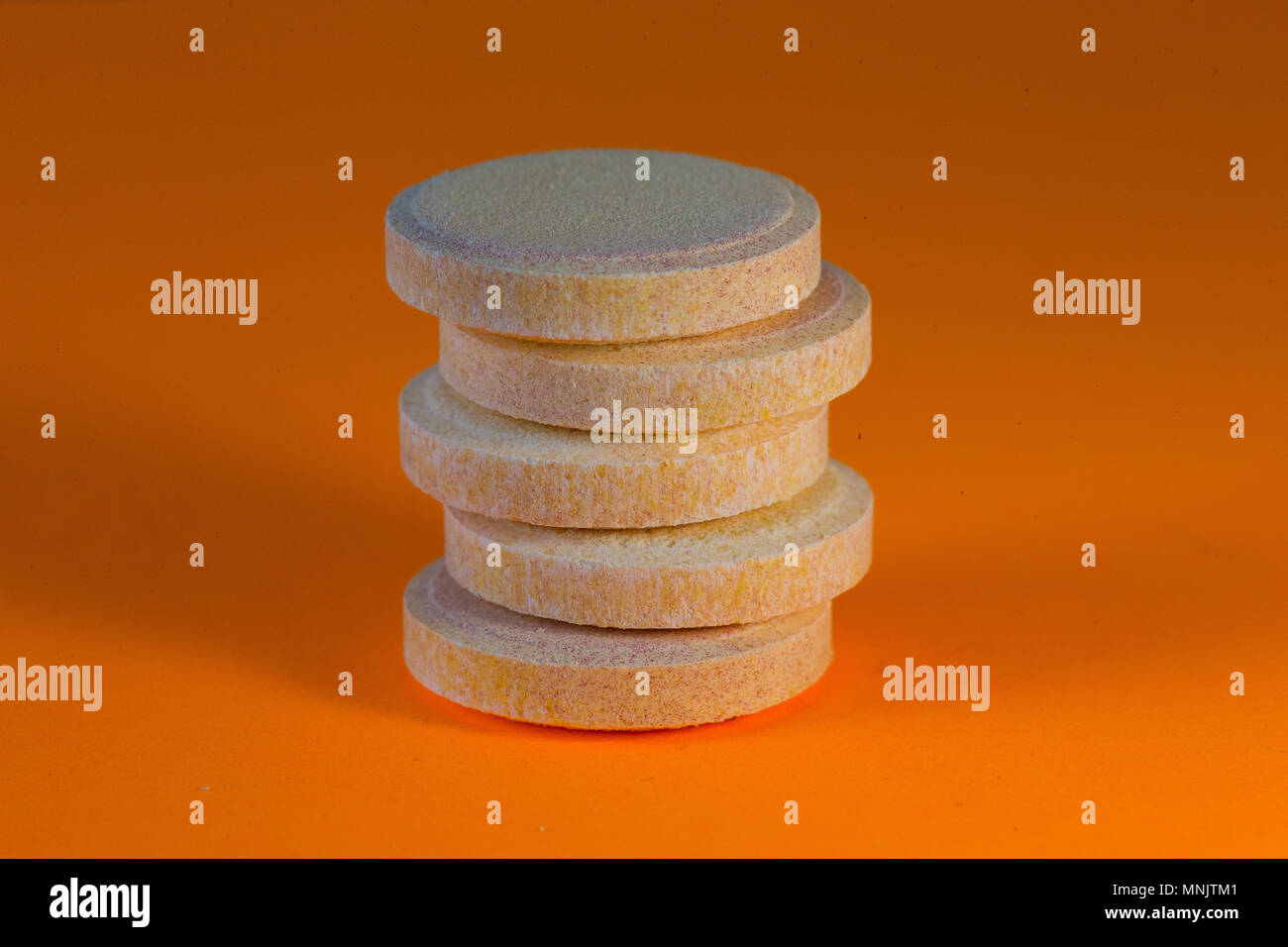 Effervescent vitamin C and Zinc orange flavour tablets Stock Photo - Alamy