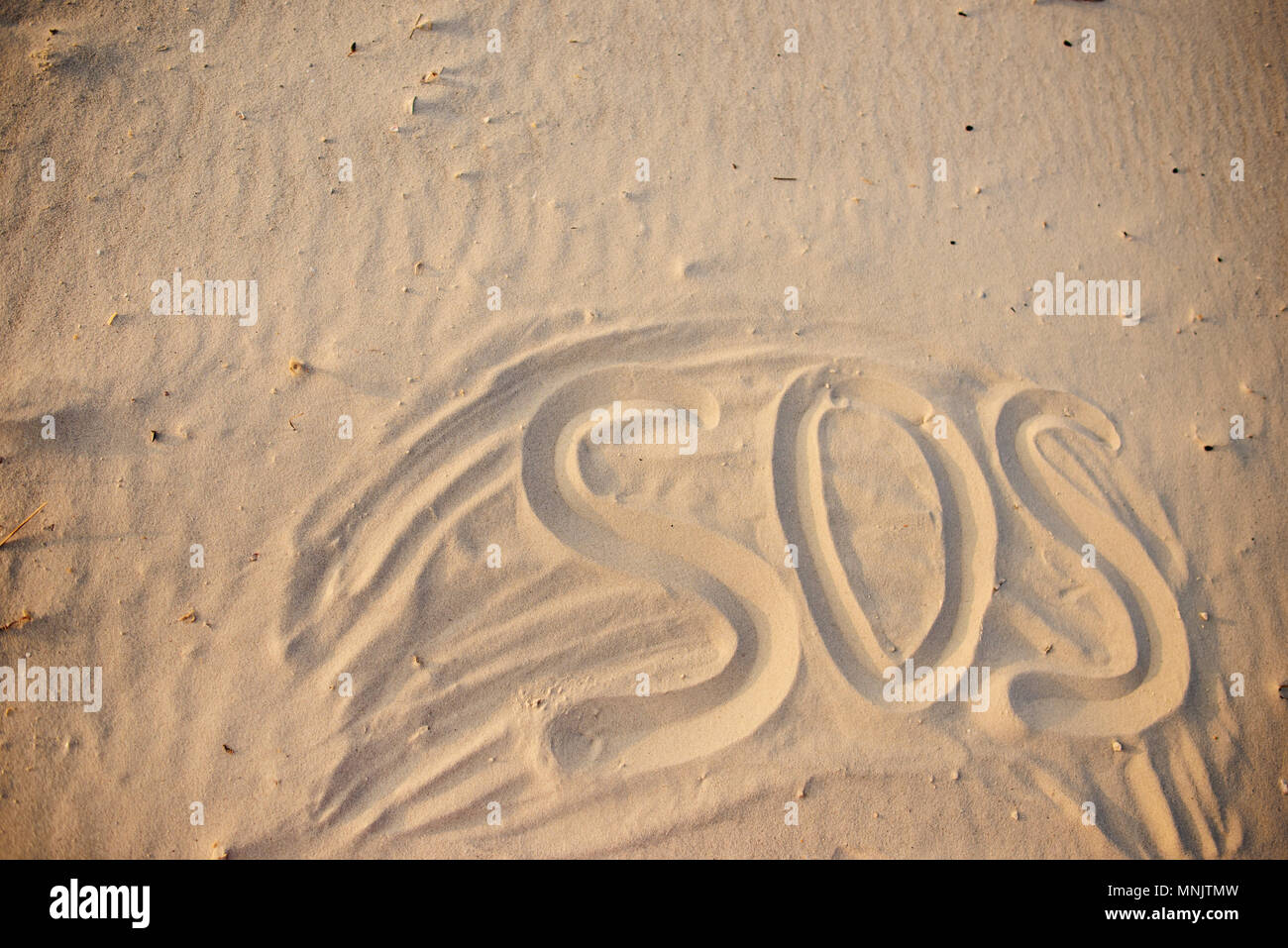 The inscription on the sand beach SOS Stock Photo - Alamy