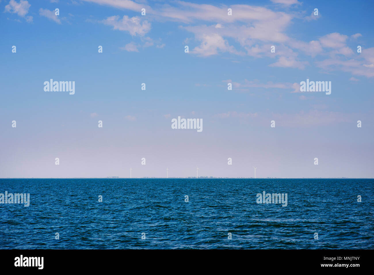 the blue ocean with dull clouds on a lovely sunny day Stock Photo - Alamy