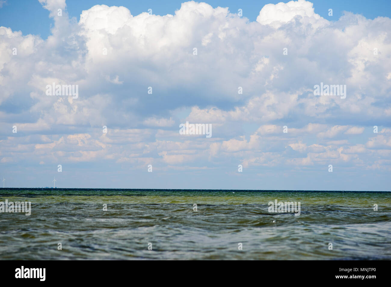 the blue ocean with dull clouds on a lovely sunny day Stock Photo - Alamy