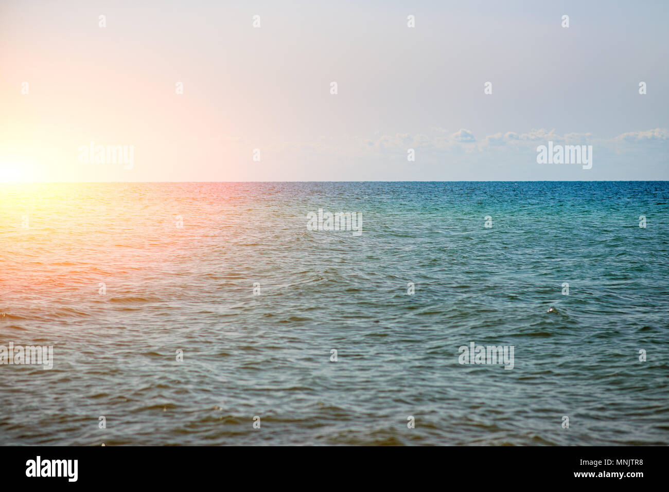 the blue ocean with dull clouds on a lovely sunny day Stock Photo - Alamy