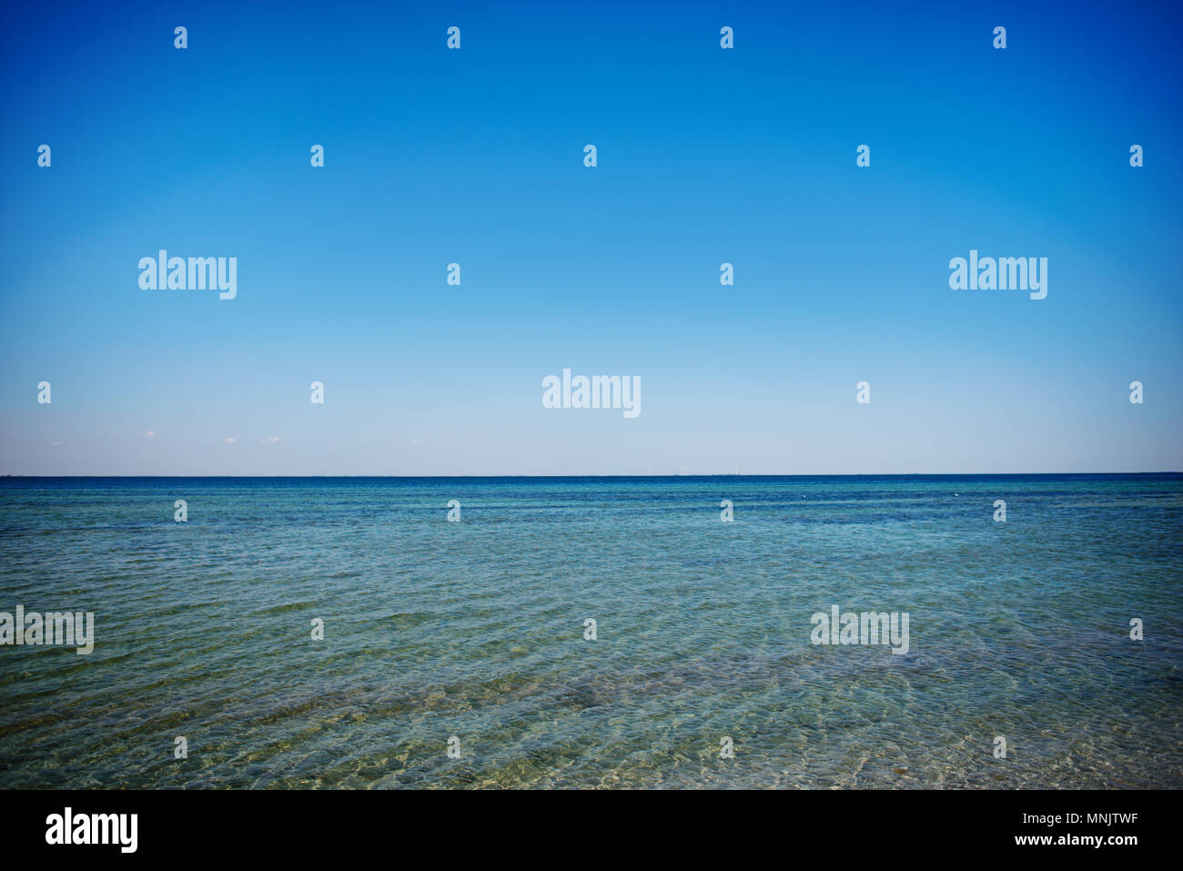 the blue ocean with dull clouds on a lovely sunny day Stock Photo - Alamy