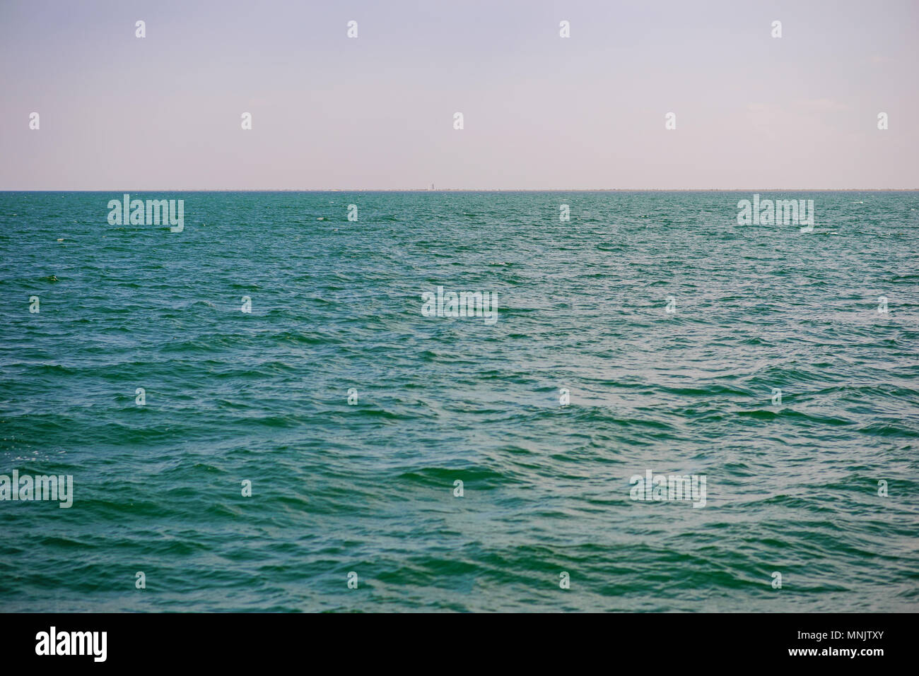 the blue ocean with dull clouds on a lovely sunny day Stock Photo - Alamy