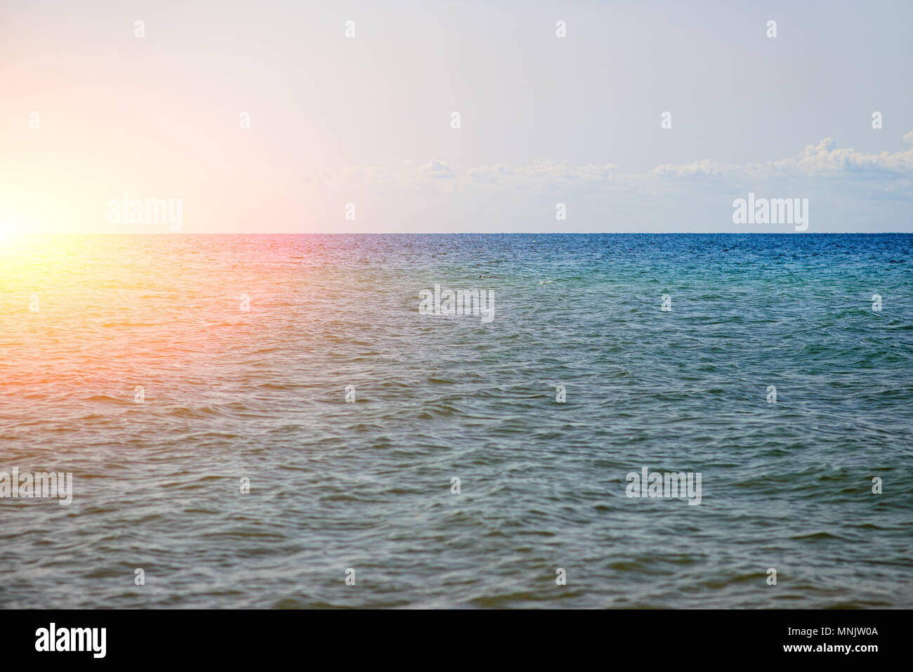the blue ocean with dull clouds on a lovely sunny day Stock Photo - Alamy