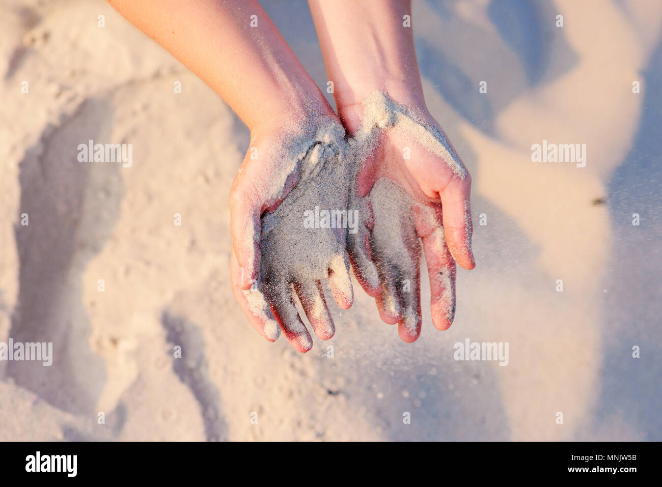 Hand pours sand beach hi-res stock photography and images - Alamy