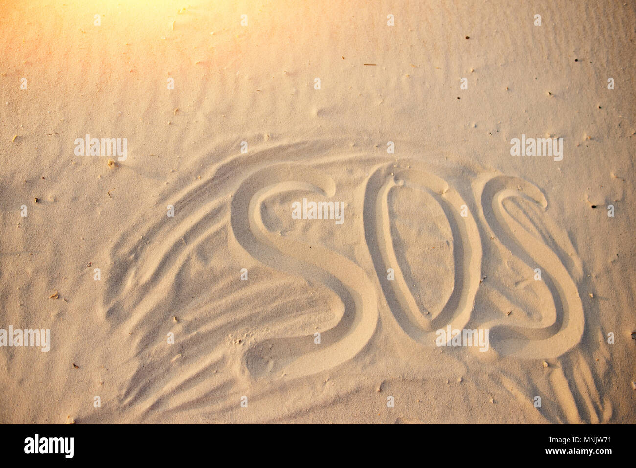 The inscription on the sand beach SOS Stock Photo - Alamy