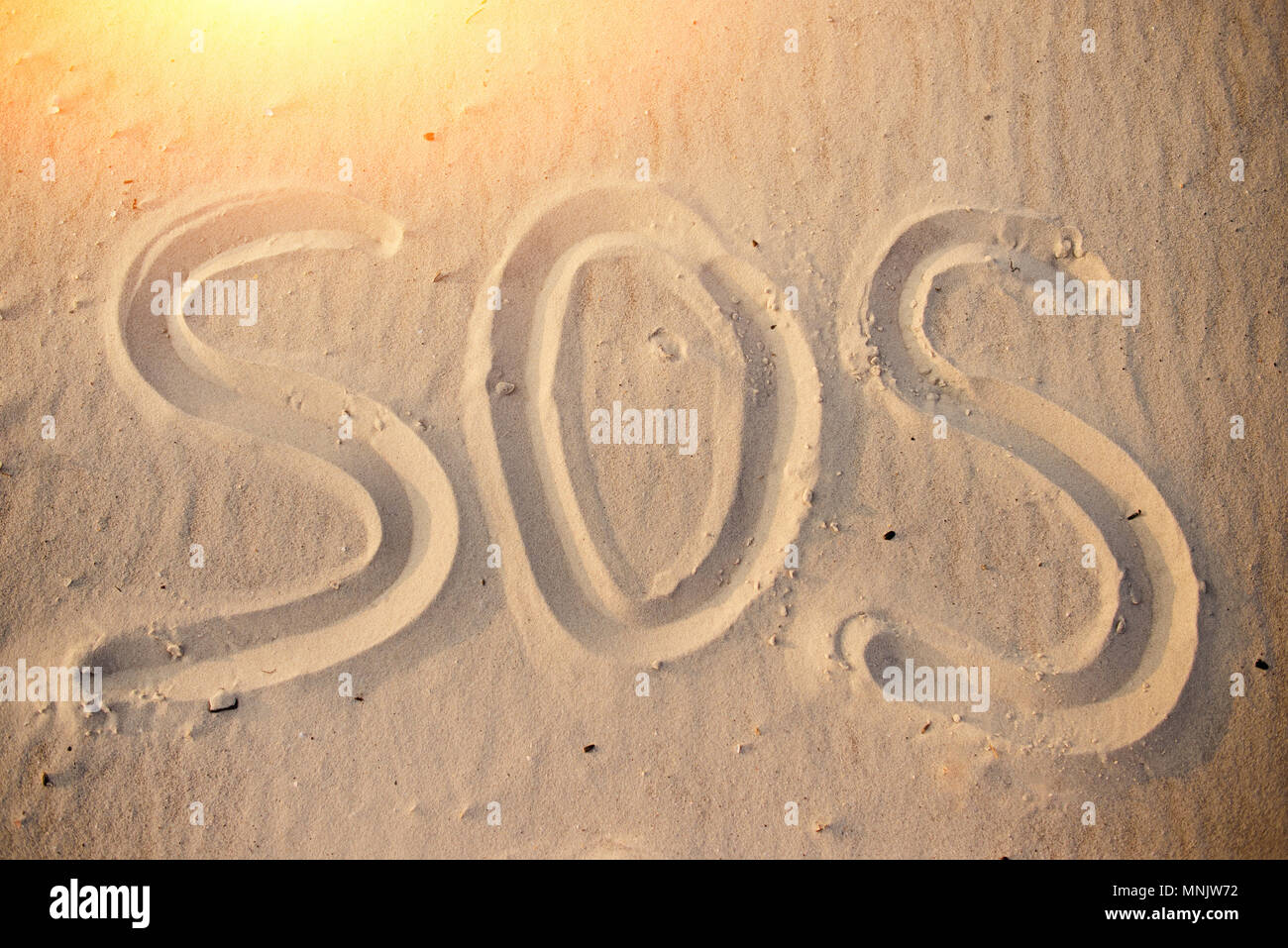 The inscription on the sand beach SOS Stock Photo - Alamy