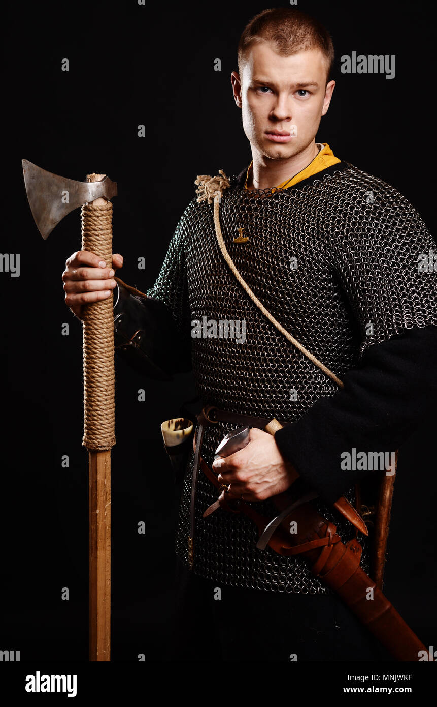 Male medieval warrior in armour and chain mail, viking with battle ax ...