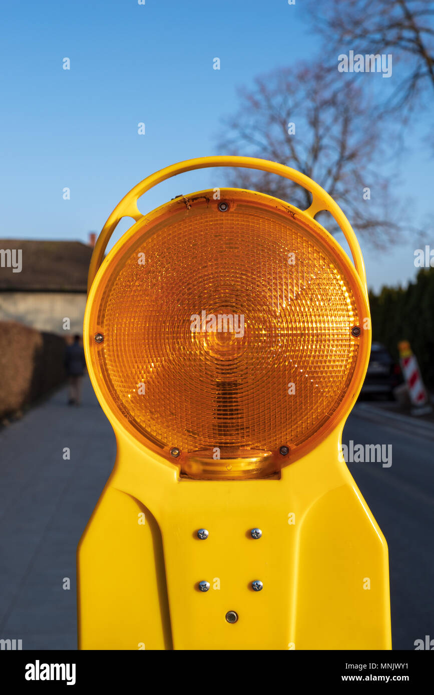 Yellow warning light of a construction site on the street Stock Photo ...