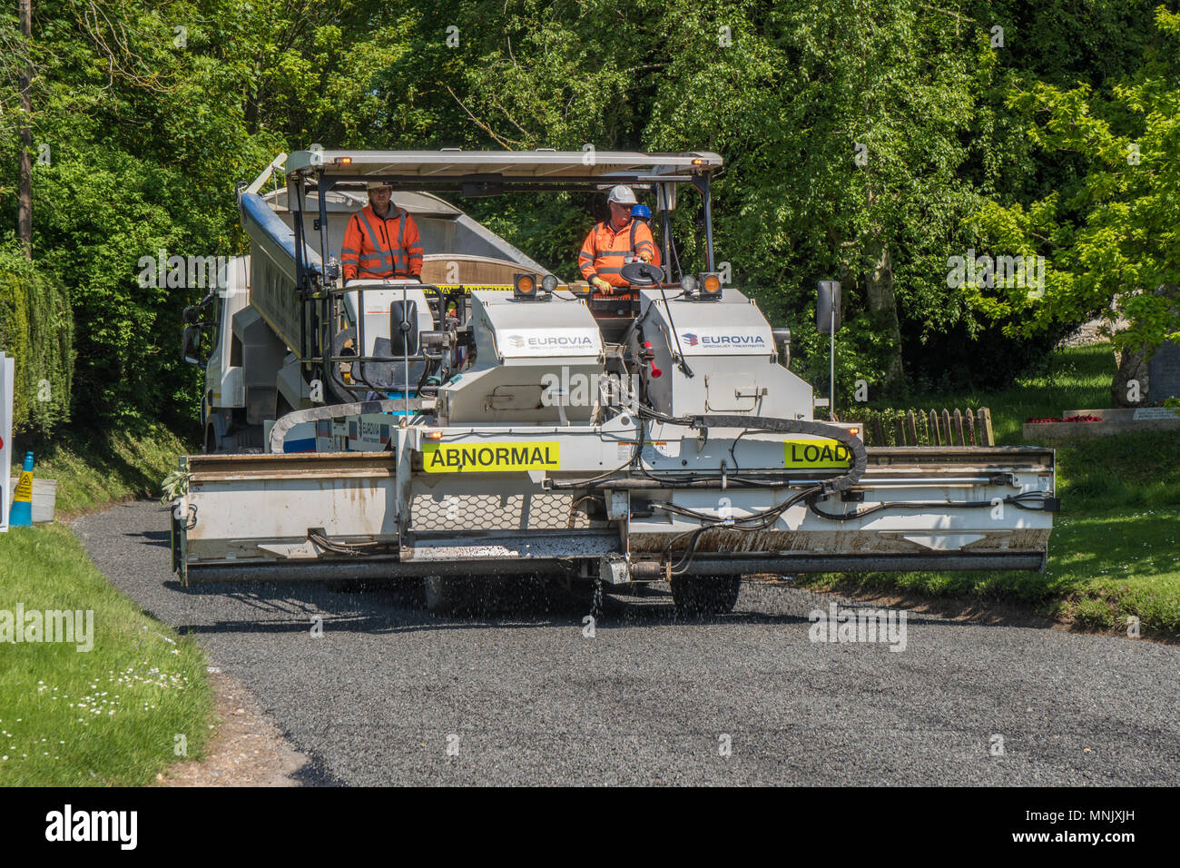 Road resurfacing team as work in an Essex village Stock Photo - Alamy