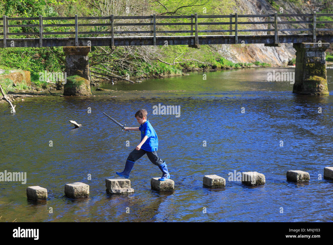 Boy jumping into a river hi-res stock photography and images - Alamy