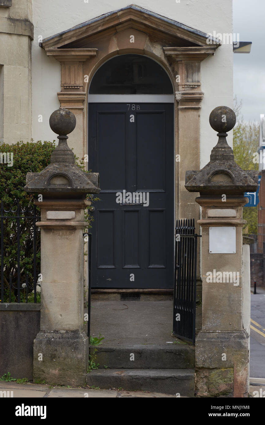 Black wooden entrance door with triangular pediment Stock Photo - Alamy