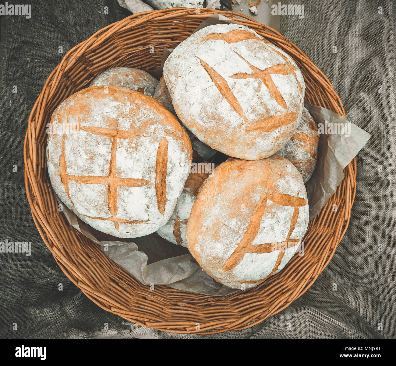 A lot of fresh bread lies in the cart on sunny day outdoors Stock Photo ...