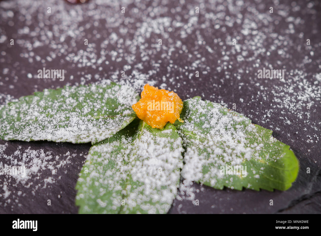 Decoration for chocolate dessert on a stone stand Stock Photo - Alamy