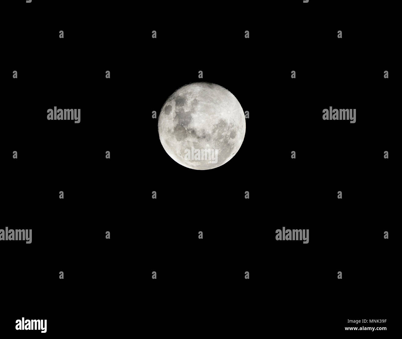 View of a full moon showing details on the moon surface Stock Photo - Alamy