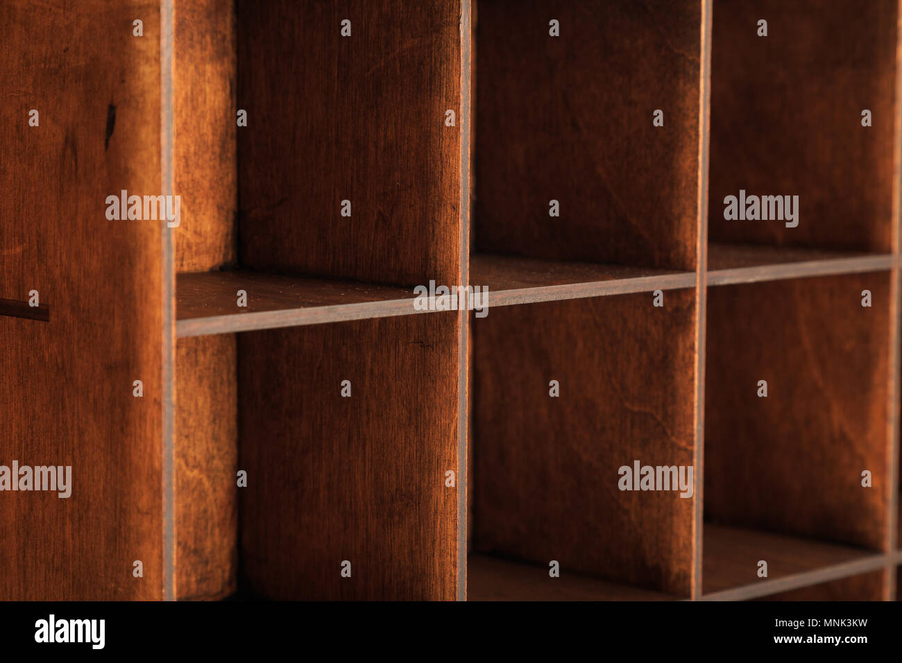 Wooden box for storing utensils with cells Stock Photo - Alamy