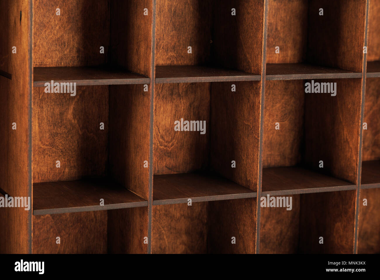 Wooden box for storing utensils with cells Stock Photo - Alamy
