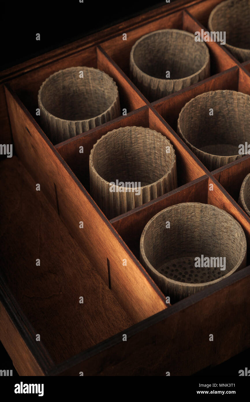 Wooden cups in a box for storing dishes Stock Photo - Alamy