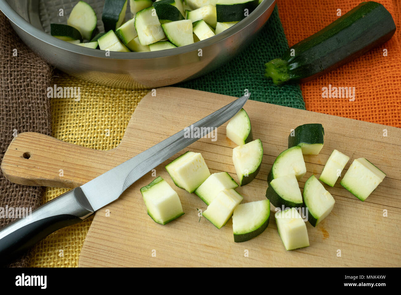 Healthy chopped zucchini on a cutting board with knife Stock Photo - Alamy