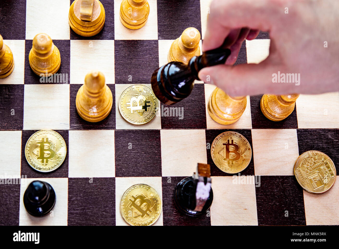 Golden bitcoin coins symbolizes elements of crypto currency with chess ...