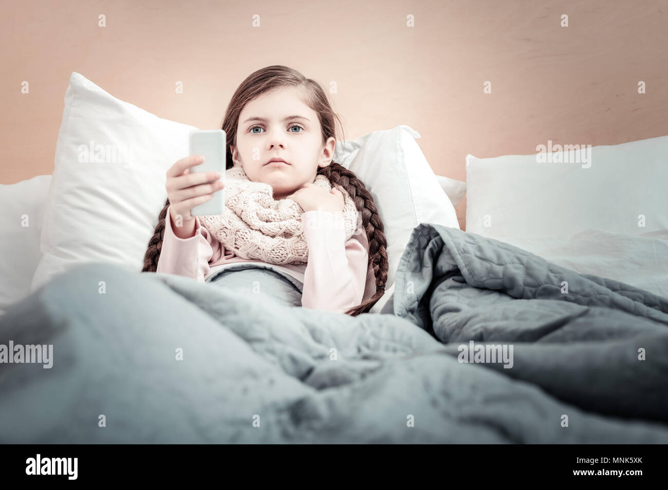 Tired child watching tv hi-res stock photography and images - Alamy