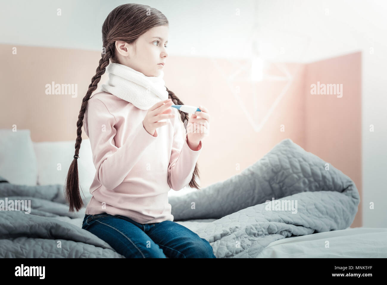 Thoughtful longhaired child counting degrees Stock Photo - Alamy