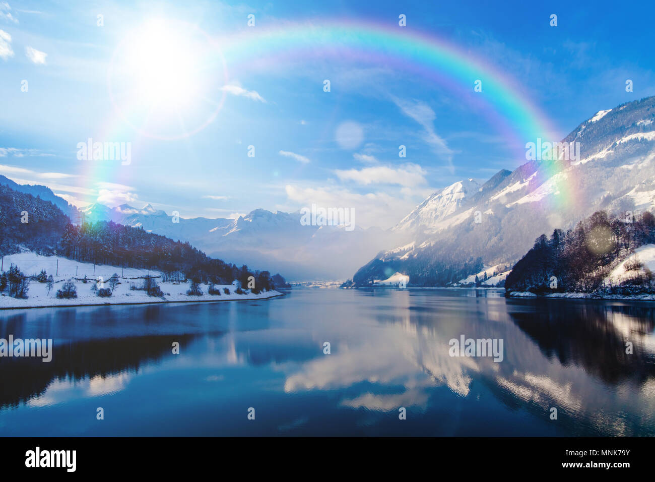 beautiful landscape in winter with rainbow Stock Photo - Alamy